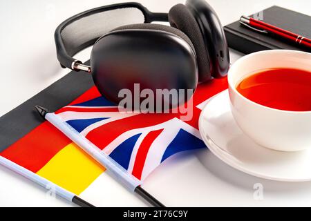 German and British flags with notepad on white background Stock Photo ...