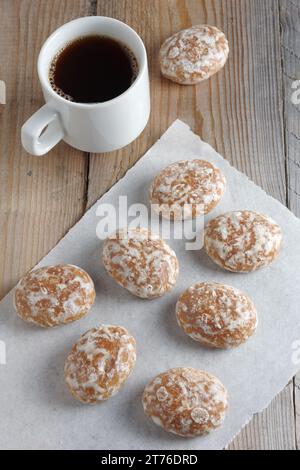 Classic Russian gingerbread cookies and cup of tea on wooden table, top ...