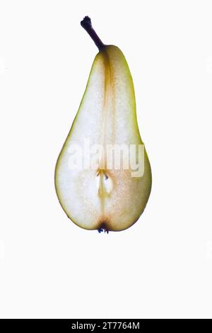 Pear slice against white background Stock Photo - Alamy