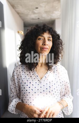 smiling kid portrait has long curly hair with school workbook isolated ...