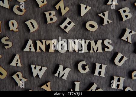 Closeup image of text ANTONYMS surrounded by scattered alphabet Stock ...
