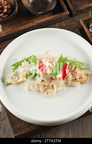 stir-fried slices sea snails or Conch Stock Photo - Alamy