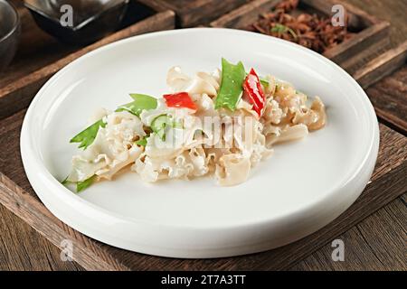 stir-fried slices sea snails or Conch Stock Photo - Alamy