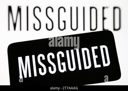 In this photo illustration, Missguided logo is seen on a smartphone and ...