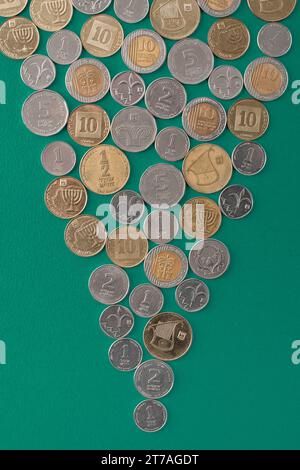Israel's new shekel (NIS) coins arranged to form the shape of the Magen ...