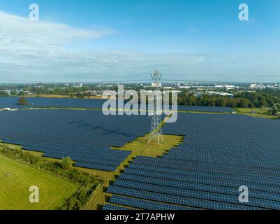 electricity pylons in the middle of a huge solar park Stock Photo - Alamy
