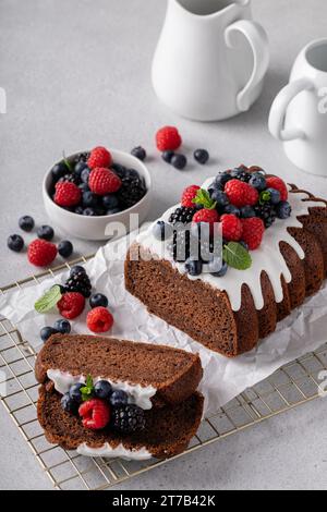 Homemade cake with fresh berries and sweet desserts on dark background ...