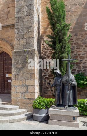Statue of a monk with a bell and a pointed hood (capirote) monk ...