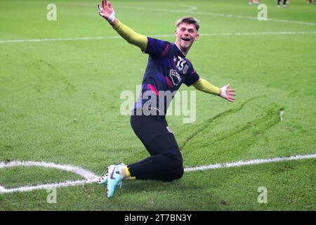 Crewe Alexandra goalkeeper Tom Booth celebrates victory in front of the ...