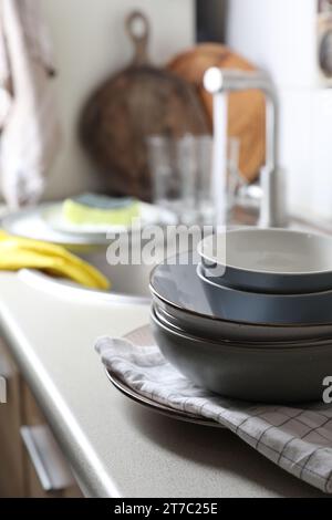Clean bowls near kitchen sink. Washing dishes Stock Photo - Alamy