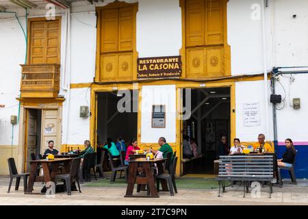 Historic Paisa style houses, outdoor seating of a restaurant, Plaza de ...
