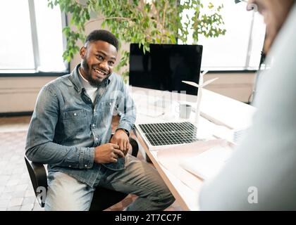 Smiley man working eco project Stock Photo - Alamy