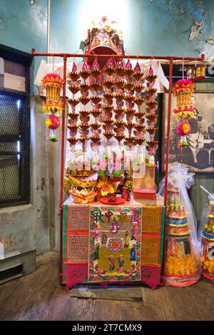 A traditional, iconic religious offering altar. At the Charoen Chai ...