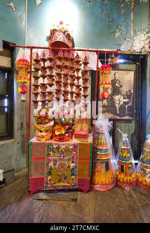 A traditional, iconic religious offering altar. At the Charoen Chai ...