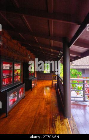 View of a wide, wood veranda with large overhang to protect from sun ...