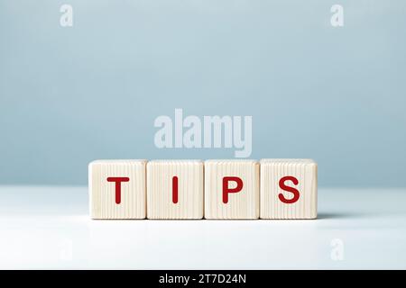 TIPS word written on wooden cubes, concept Stock Photo - Alamy