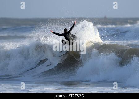 Surfing action on the Gower Stock Photo - Alamy