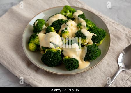 Yummy Cheesy Steamed Broccoli on a Plate, side view Stock Photo - Alamy