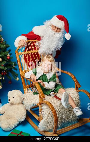 A Christmas Tree, rocking chair, teddy bear, Raggedy Ann doll and ...