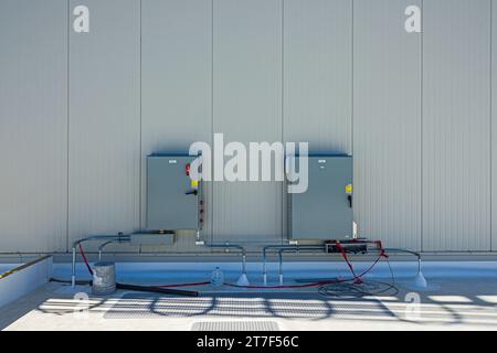 Electrical control panels on outside wall on roof of cold-storage ...