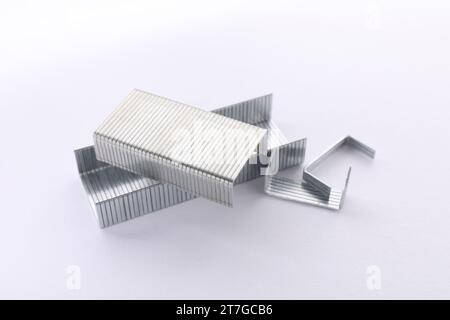 Staple gun refills on white background. Office supplies Stock Photo - Alamy