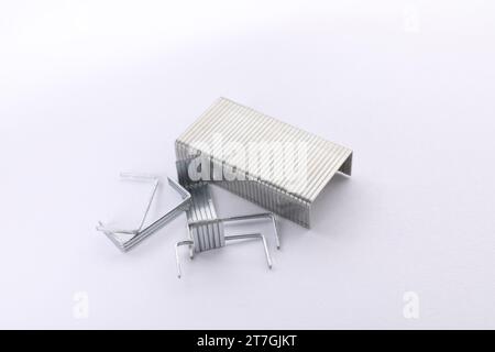 Staple gun refills on white background. Office supplies Stock Photo - Alamy