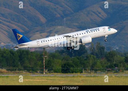 Air Astana Embraer 190 E2 aircraft taking off at Almaty Airport with ...