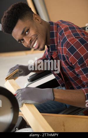 Carpenter Rubbing Wood with Sandpaper Stock Photo - Alamy