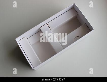 Mockup Of Cardboard Closet With Shelves And Compartments In Empty Room ...