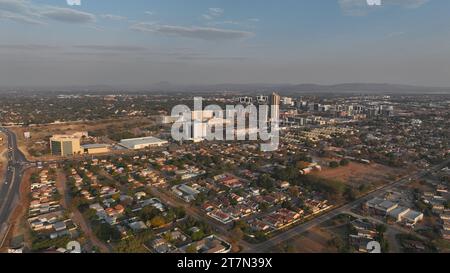 A bustling cityscape of Gaborone, Africa, featuring Three Chiefs ...