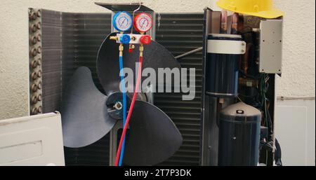 Close up of manifold meters used for checking air conditioner freon in ...