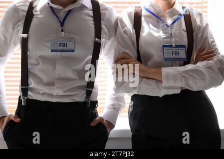 FBI agents near window in room Stock Photo - Alamy