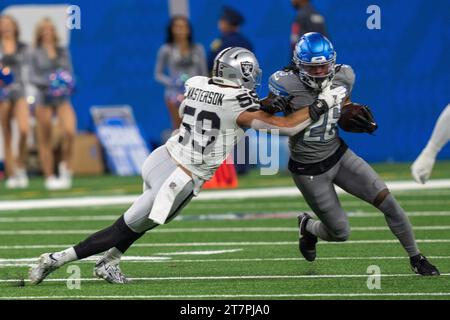 Detroit Lions running back Jahmyr Gibbs (0) is brought down by Green ...