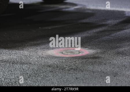 Works on the circuit surface after damages caused by a manhole cover ...