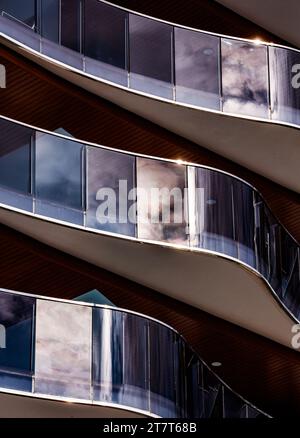 reflections on the wave-shaped balconies Stock Photo - Alamy