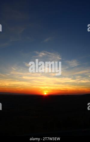Cumulus clouds and different color tones in the sky at sunset. Dance of ...