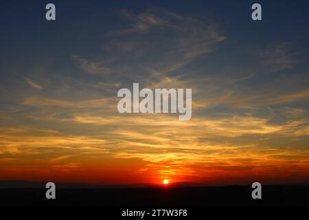Cumulus clouds and different color tones in the sky at sunset. Amazing ...