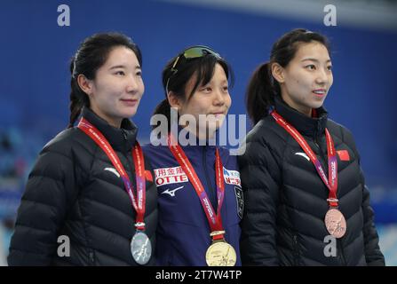 Gold medalist Han Mei, of China, celebrates on the podium during the ...