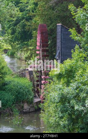 The restored and working iron waterwheel on the River Mole at Painshill ...