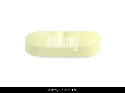One yellow pill isolated on white. Medicinal treatment Stock Photo - Alamy