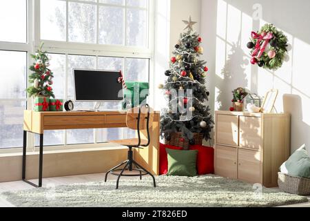 Interior of office with workplace and Christmas trees Stock Photo - Alamy