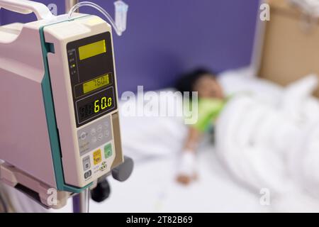 Child's hand fever patients have IV tube in hospital. Toddler girl ...