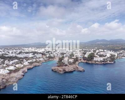 Aerial view of Cala Esmeralda , above the sea looking back at Menorca ...