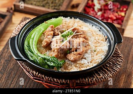 Chinese claypot rice with pork ribs, straw mushrooms and sunny side up ...