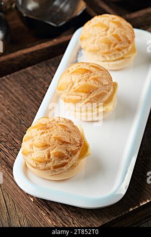dim sum bread Pineapple bun,Cantonese Polo Bun Stock Photo - Alamy
