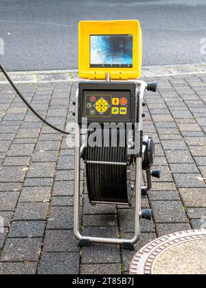 Blocked pipe. Drain inspection with camera. Screen shows the cleaning ...