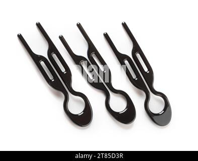 Black hair clips on isolated white background Stock Photo - Alamy