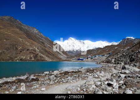 Mount Cho Oyu peak with Ngozumba glacier and stone pyramid, trek to Cho ...