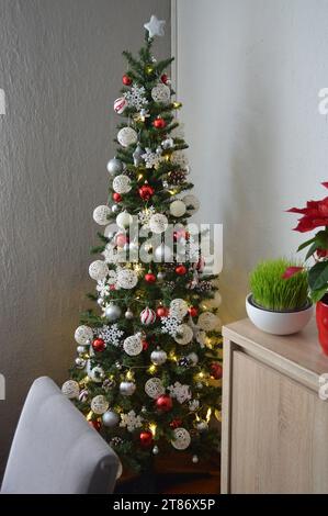 Christmas tree in corner of the room Stock Photo - Alamy