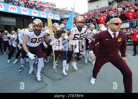 Minnesota head coach P. J. Fleck leads his team onto the field before ...